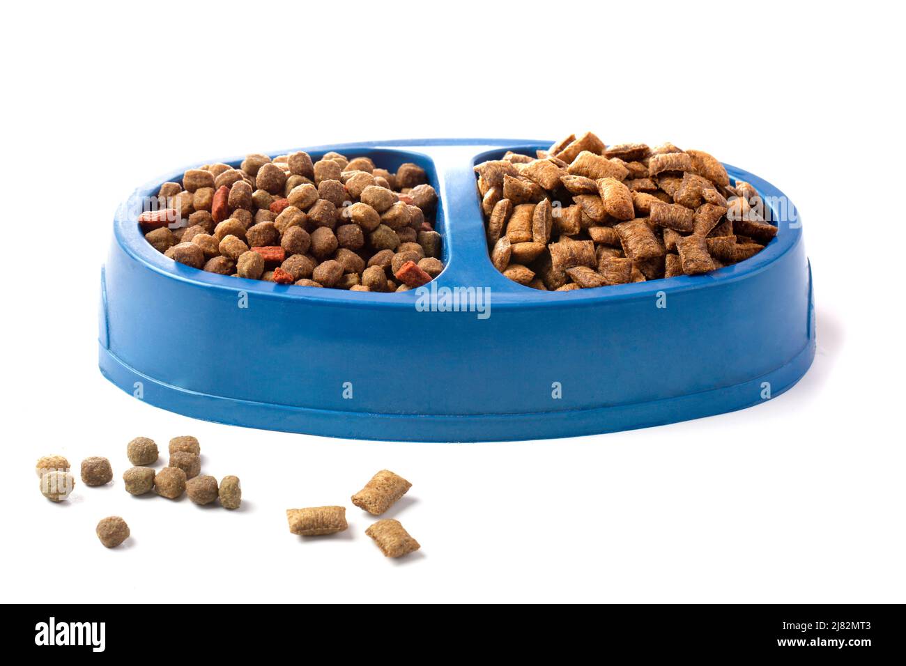 Dry cat food in an iron bowl on a white background Stock Photo - Alamy