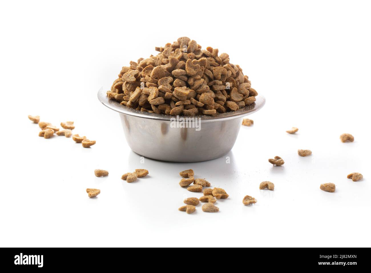 Dry cat food in an iron bowl on a white background Stock Photo - Alamy