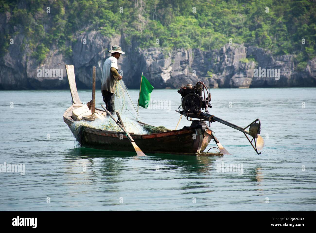 Thai man fisher people sailing wooden long tail boat fishery floating ...