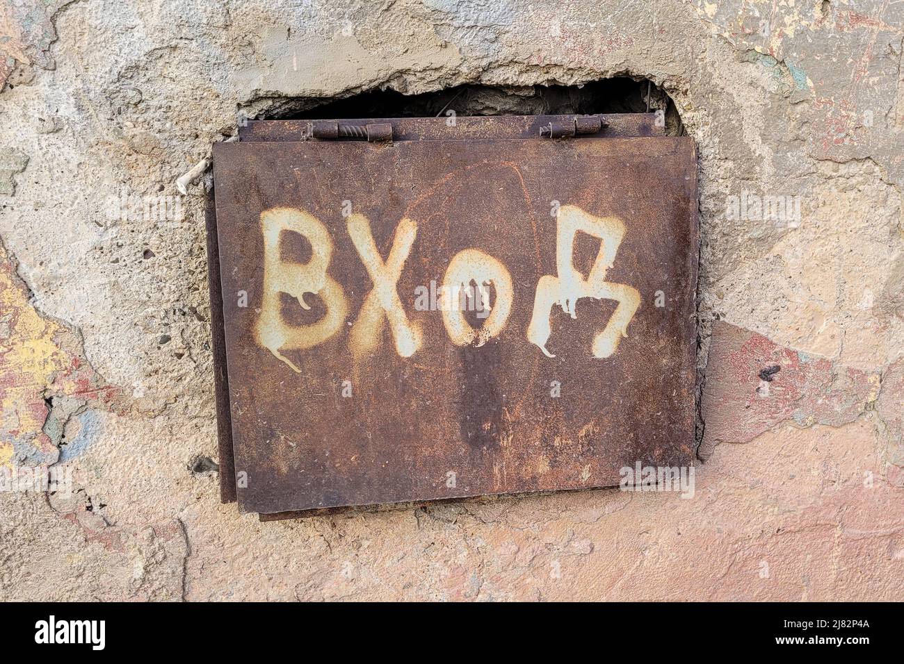 A metal sheet with the inscription Entrance closes the basement of a ...