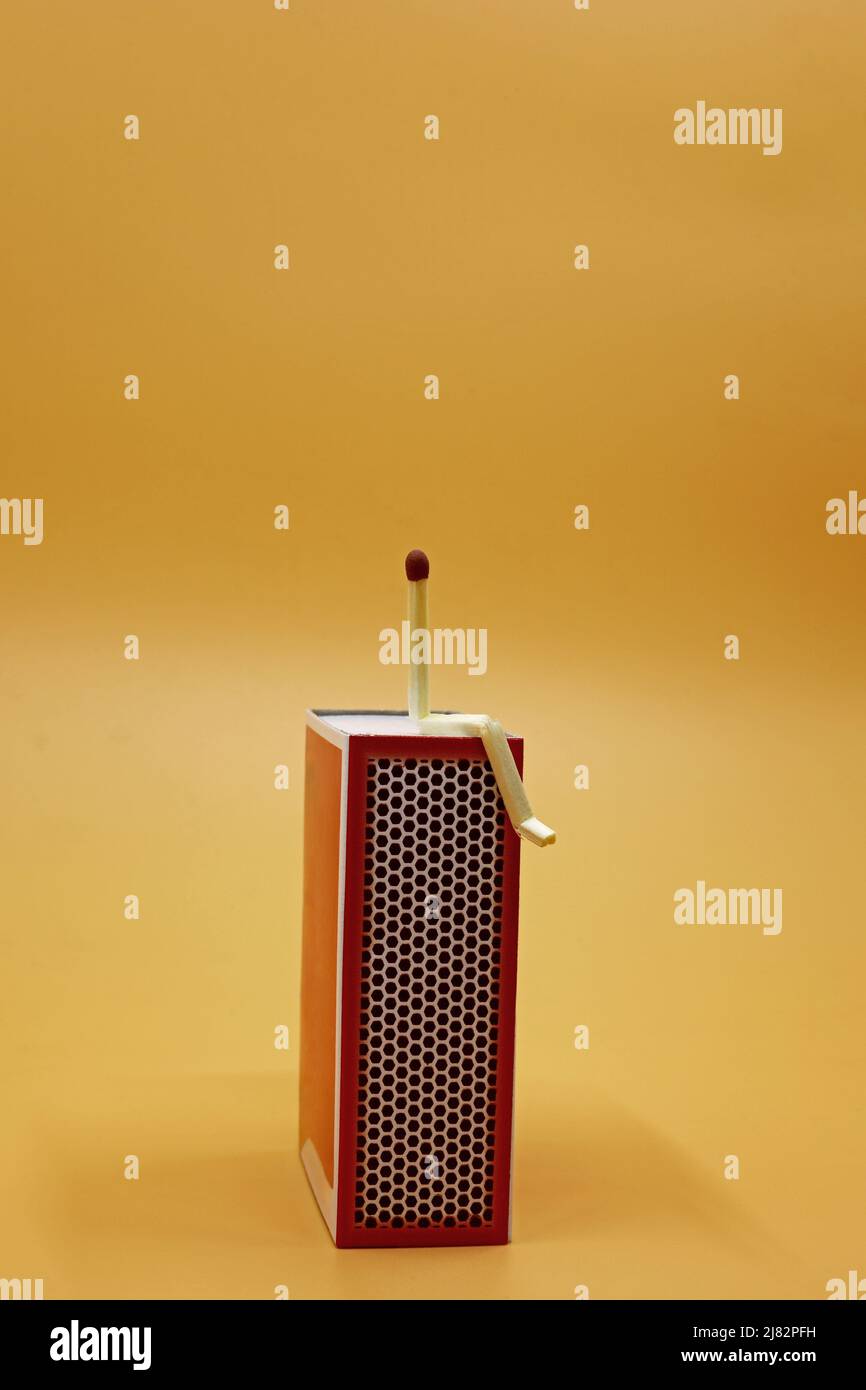 pile of matchstick on yellow background Stock Photo - Alamy