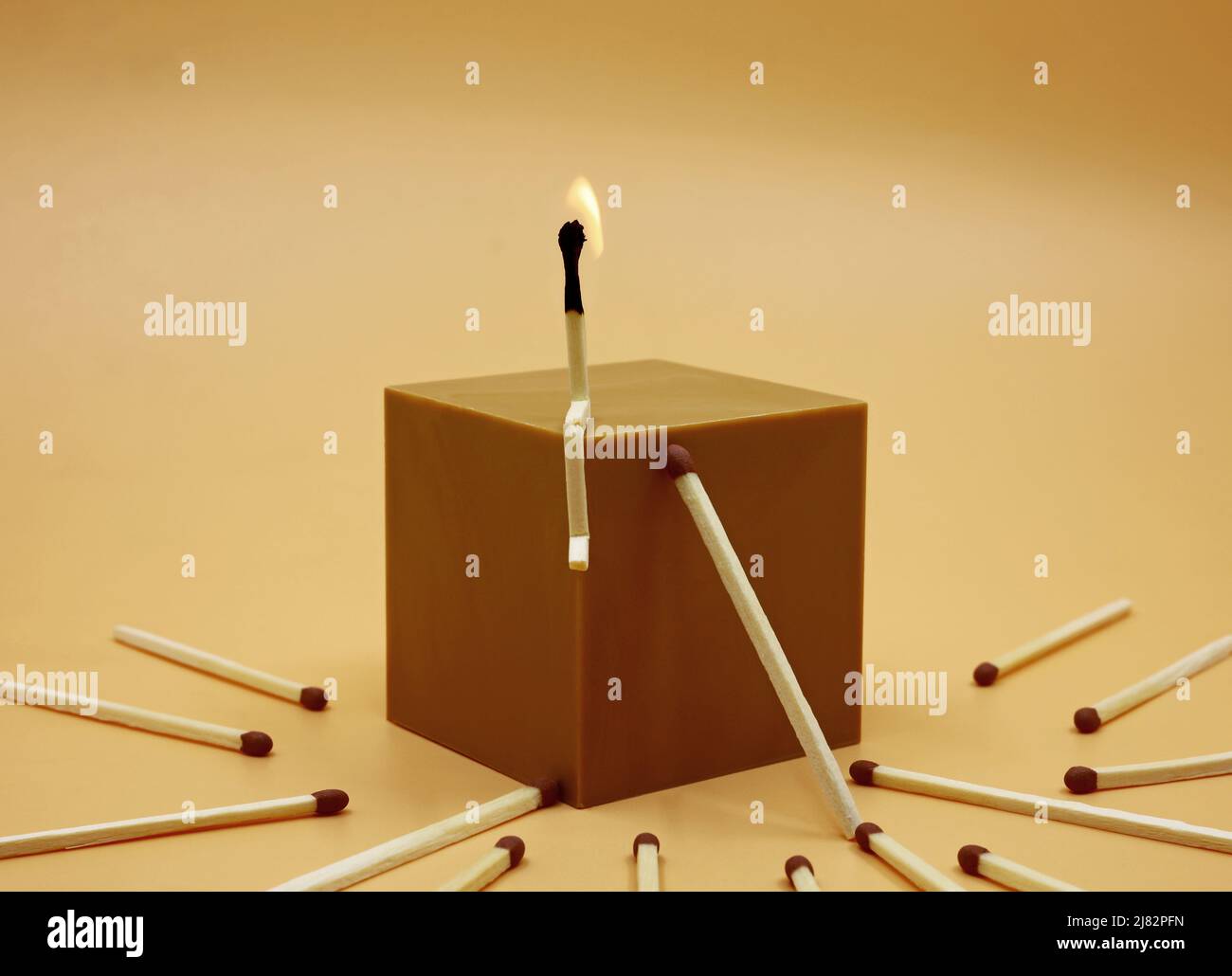pile of matchstick on yellow background Stock Photo - Alamy