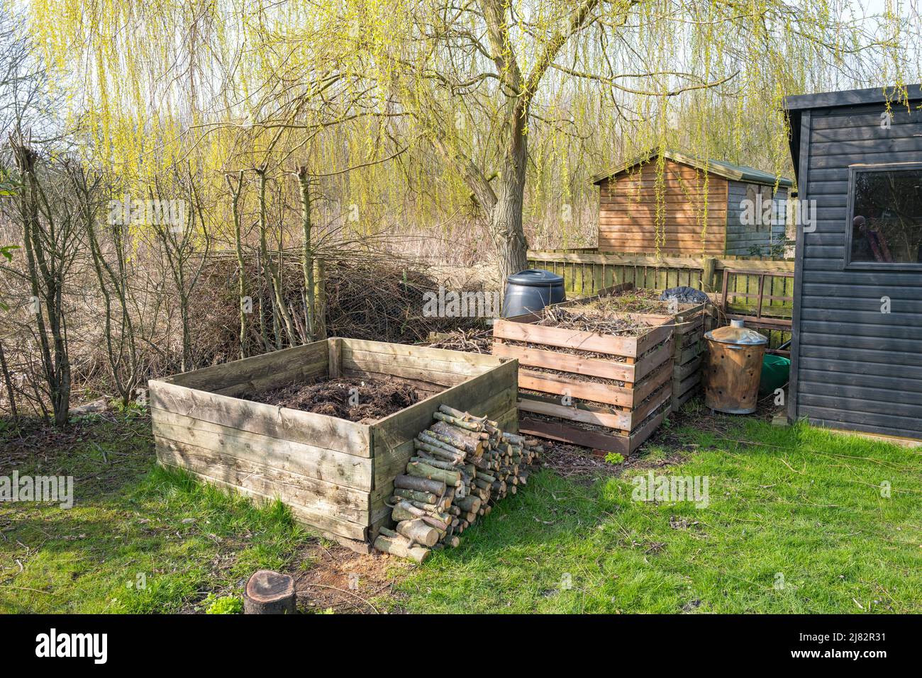 Compost heaps and wood pile Stock Photo - Alamy