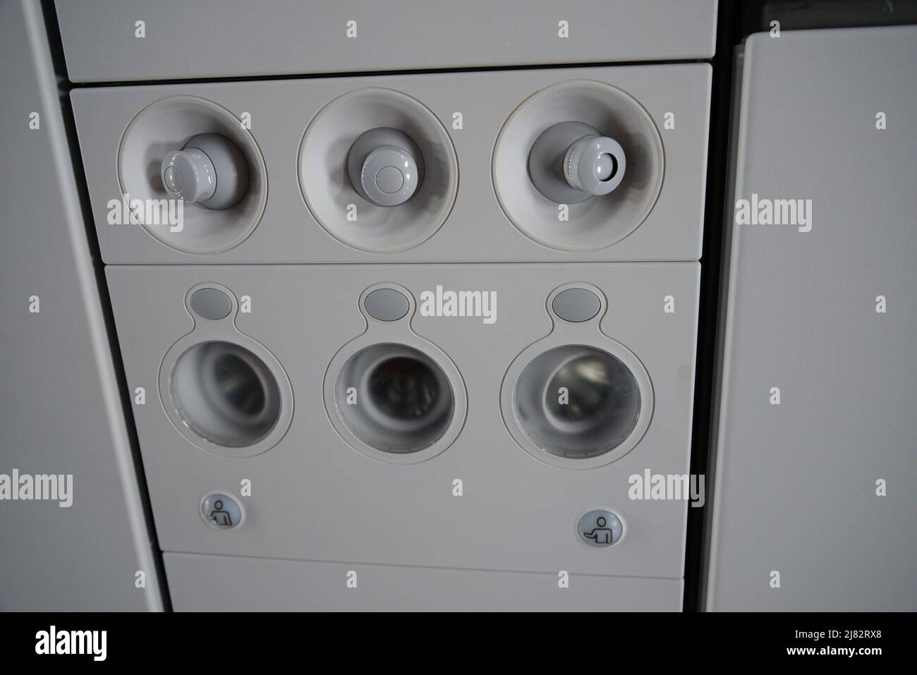 The overhead air vents and lights in an aircraft. Above your cabin seat ...