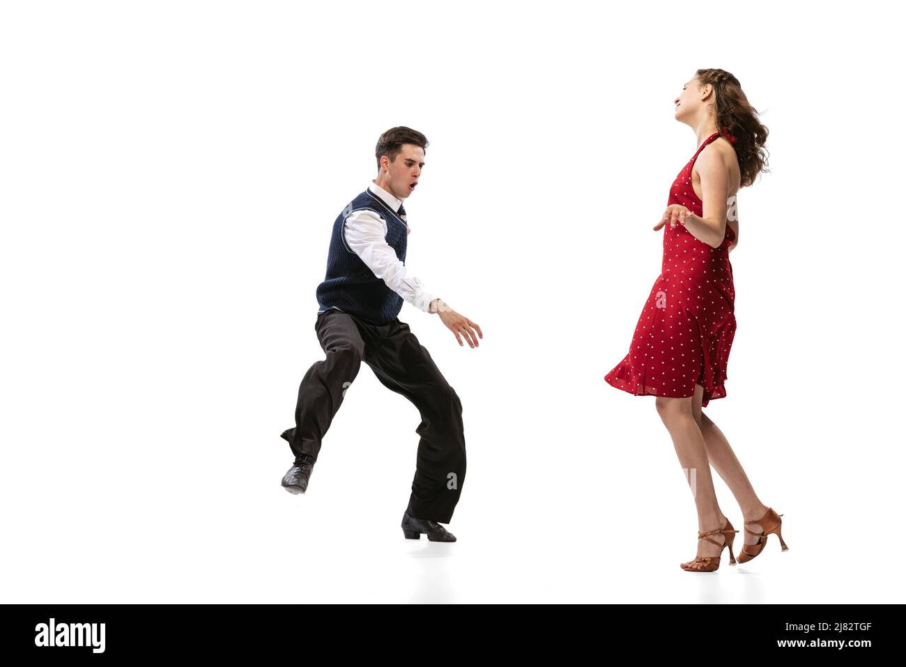 Beautiful girl and stylish man in vintage retro style outfits dancing ...