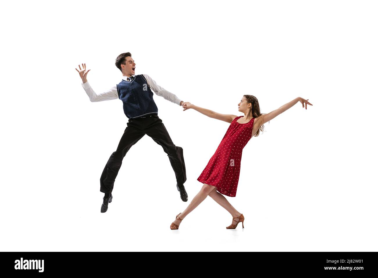 Beautiful girl and stylish man in vintage retro style outfits dancing ...