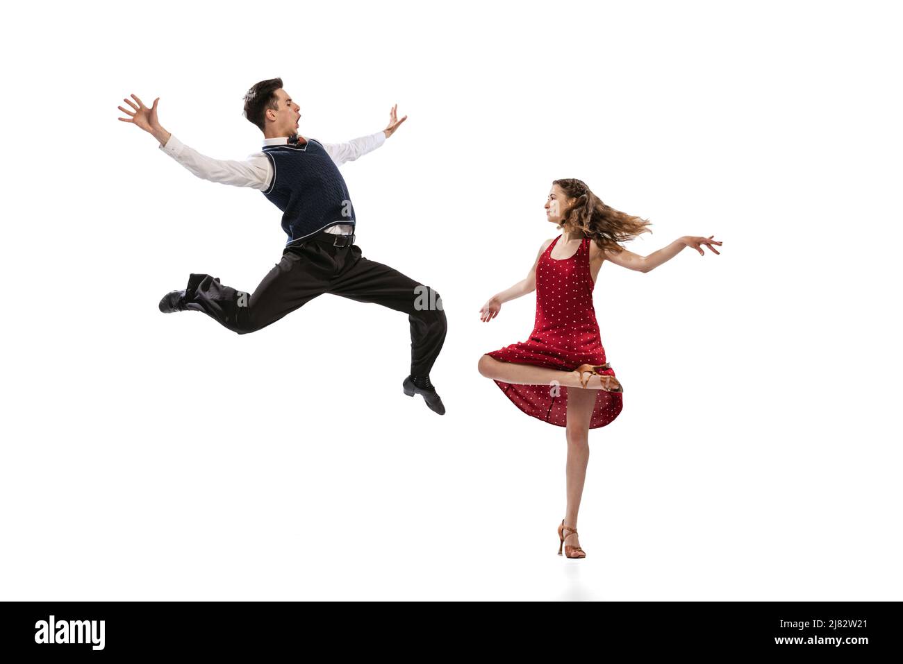 Beautiful girl and stylish man in vintage retro style outfits dancing ...