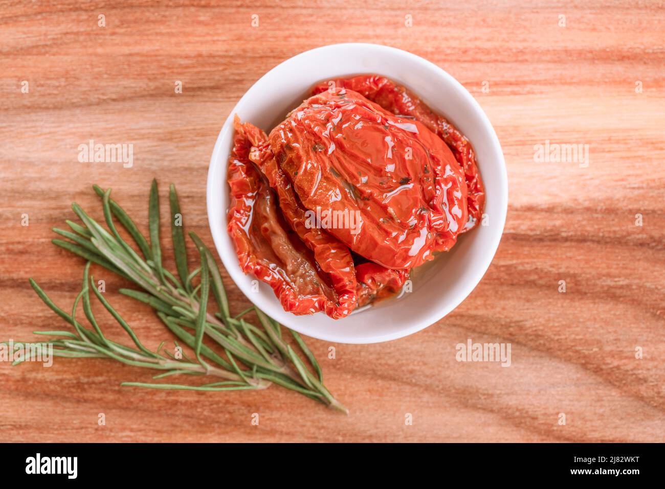 Top view on classic italian appetizer - sliced sun dried tomatoes with ...
