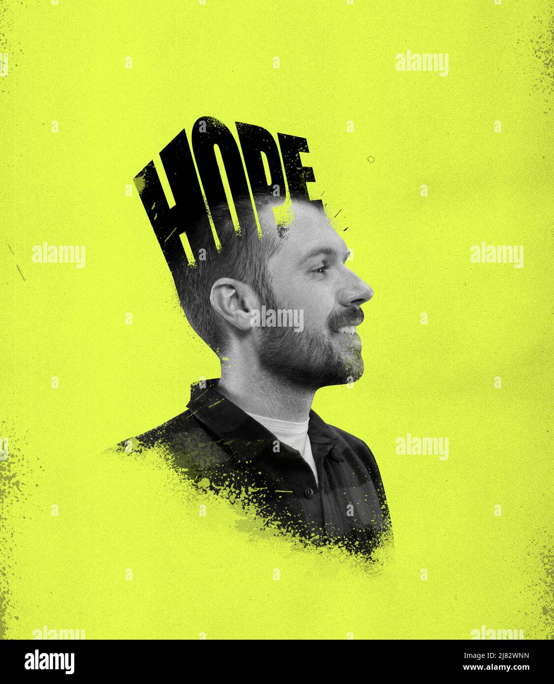 Creative portrait young astonished man with lettering hope on his head ...