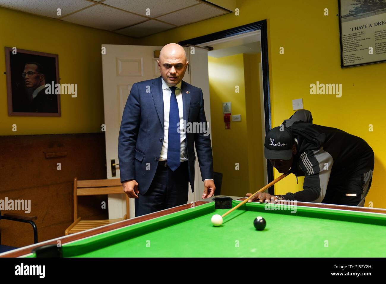 Health Secretary Sajid Javid plays a game of pool during a visit to the ...