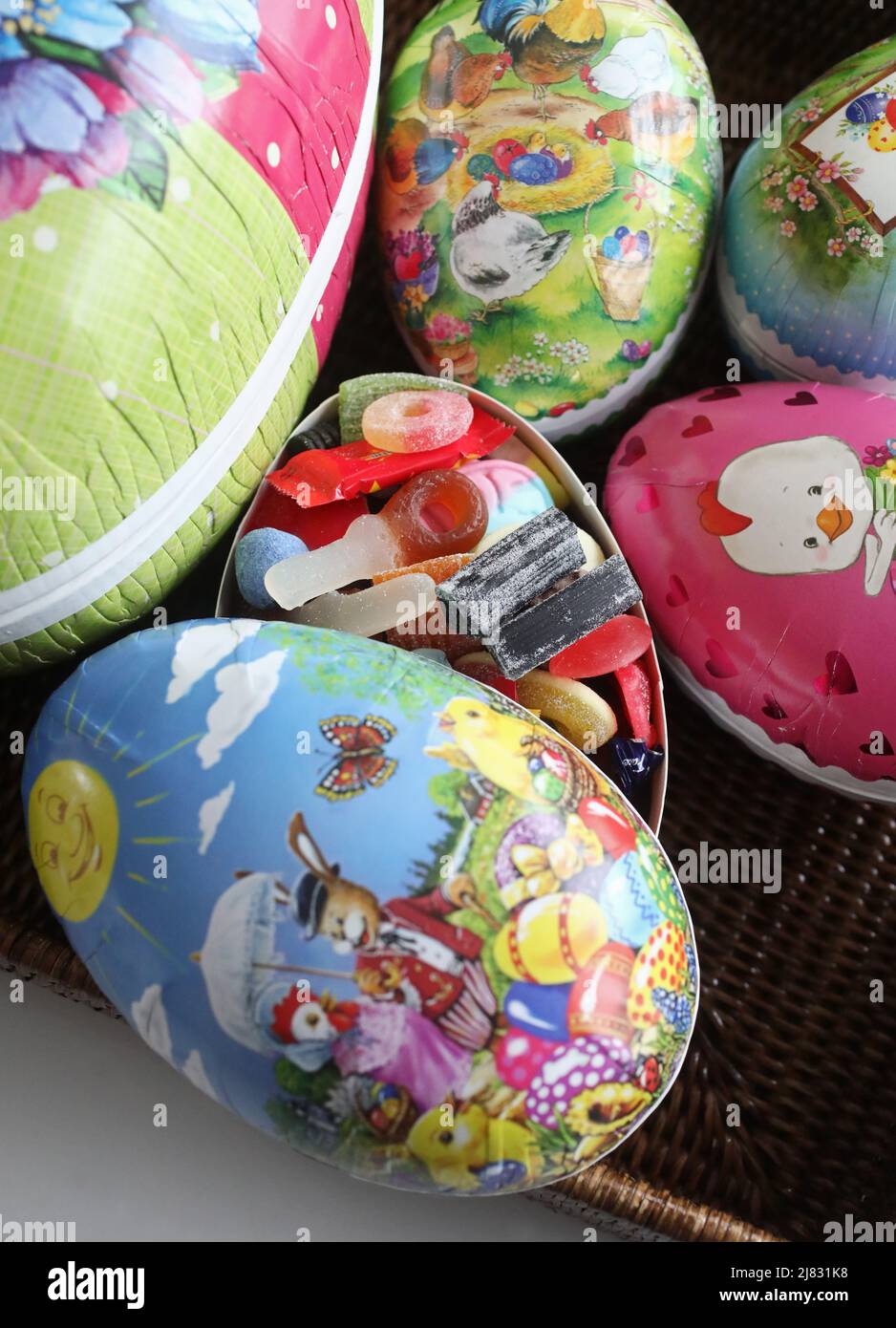 Easter traditions. Big Easter eggs filled with candy Stock Photo - Alamy