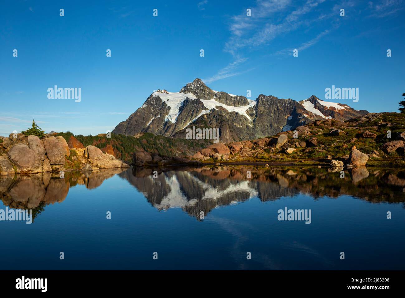 WA21529-00...WASHINGTON - Mount Shuksan reflecting in a tarn at Huntoon ...