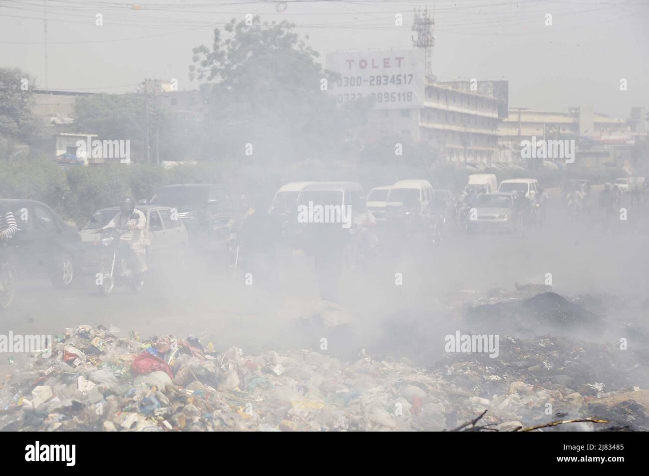 Hyderabad, Pakistan, May 12, 2022. Heavy dark smoke rising burning ...