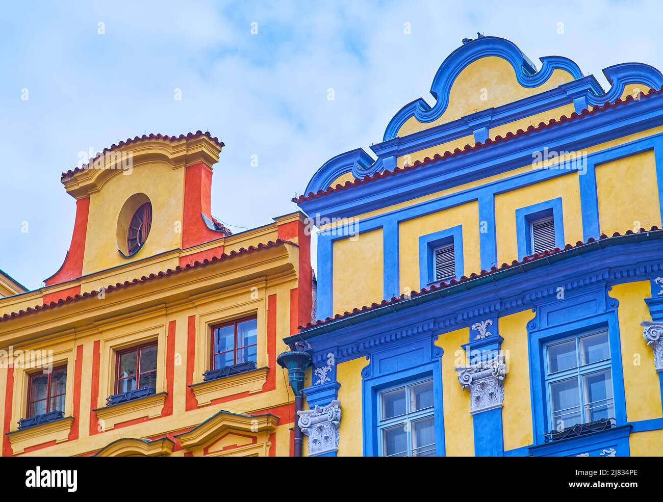 Relief colorful pediments of the medieval townhouses, located in the ...
