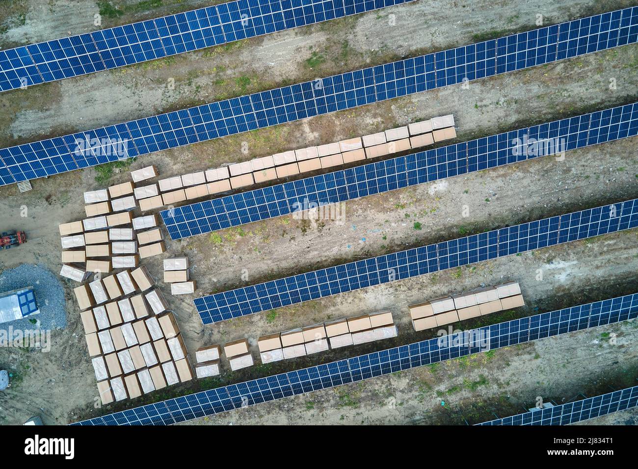 Aerial view of big electric power plant under construction with many ...