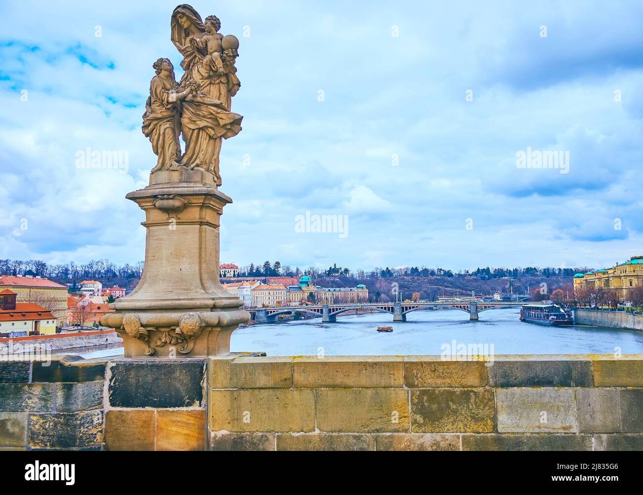 The stone statue of St Anne on the Charles Bridge with Vltava River and ...