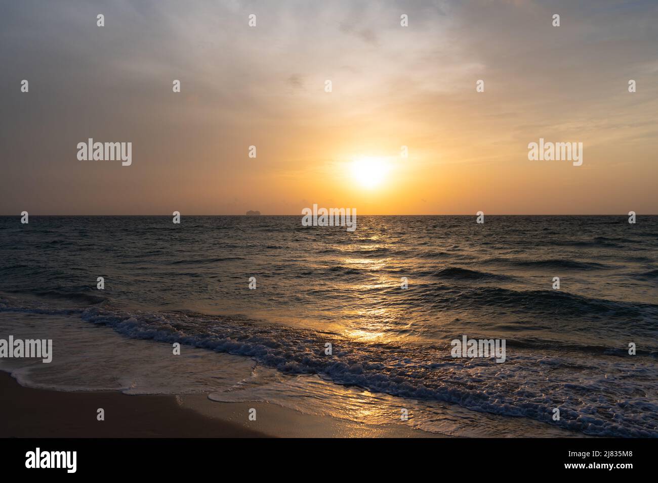 beautiful afterglow sky with waves on sea water Stock Photo - Alamy