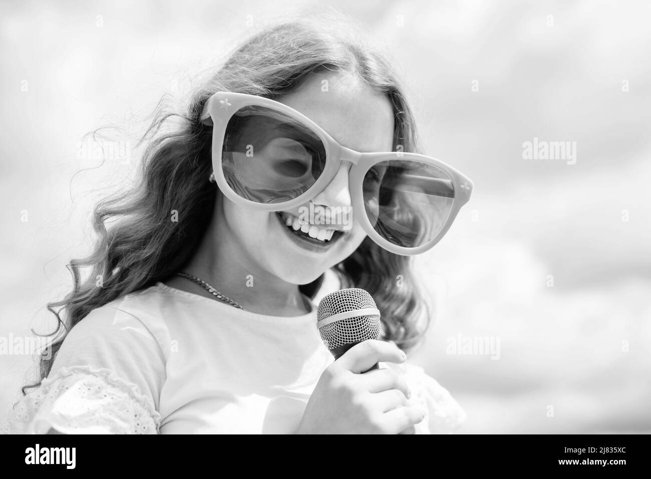 cheerful child singer singing in microphone music style, vocal Stock ...