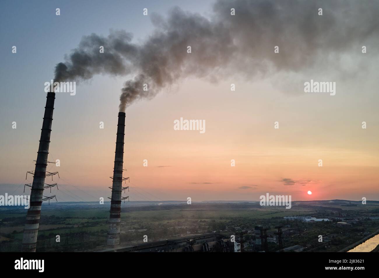 Aerial view of coal power plant high pipes with black smokestack ...