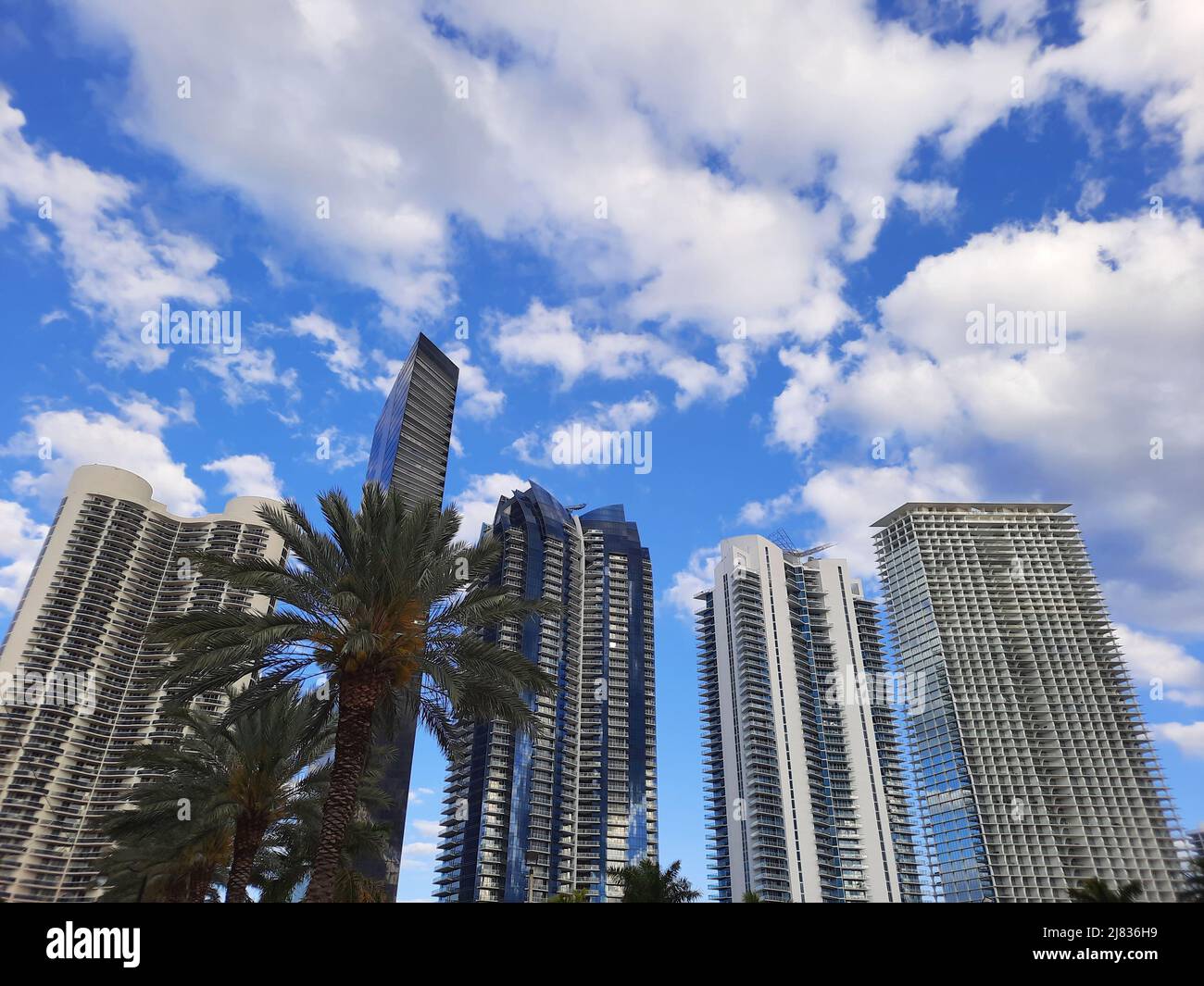 High-rise buildings modern urban architecture on cloudy sky in Sunny ...