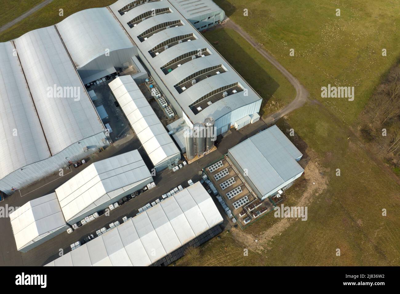 Aerial view of modern factory structure for production and distribution ...