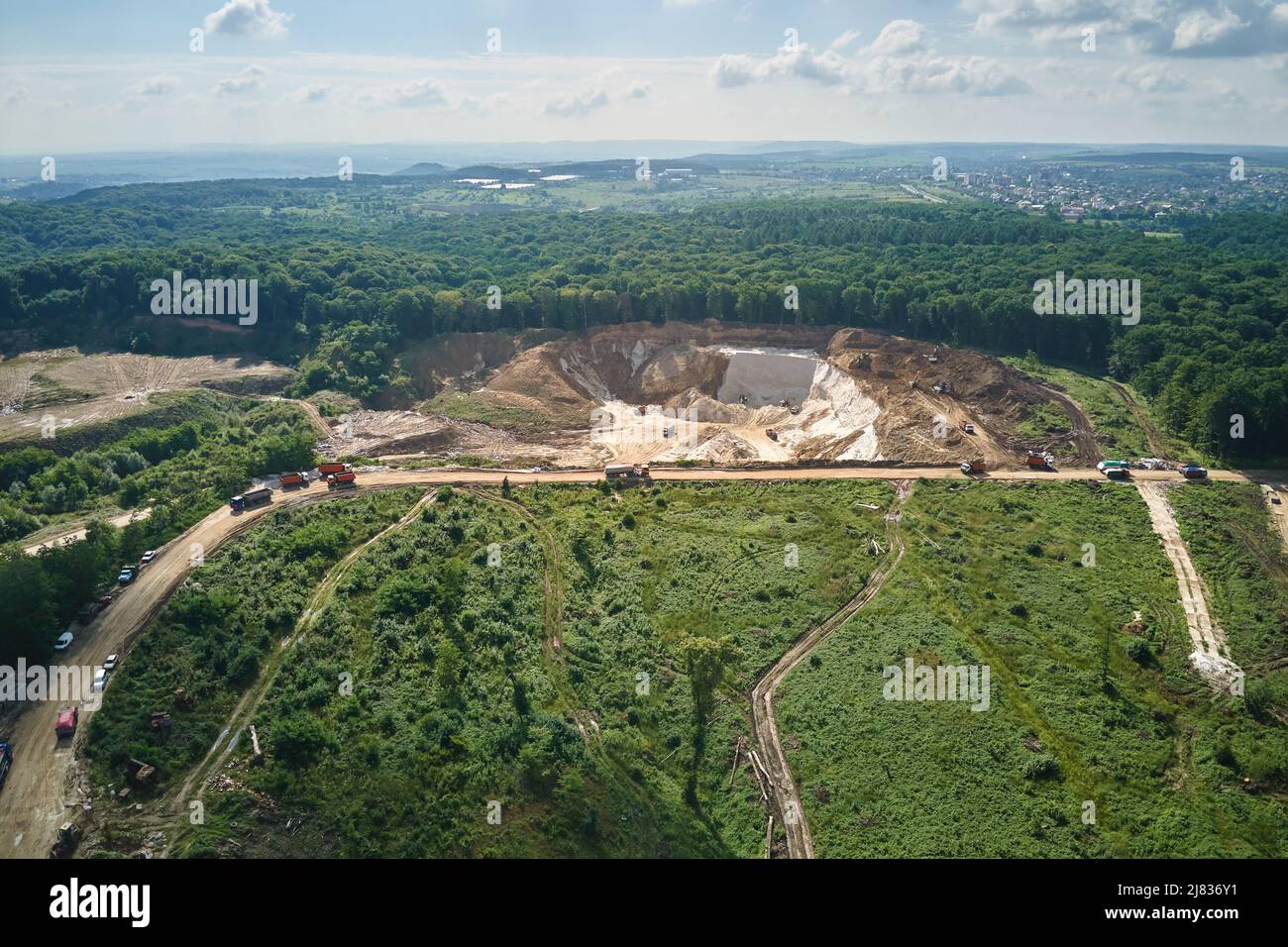 Aerial view of open pit mining of limestone materials for construction ...