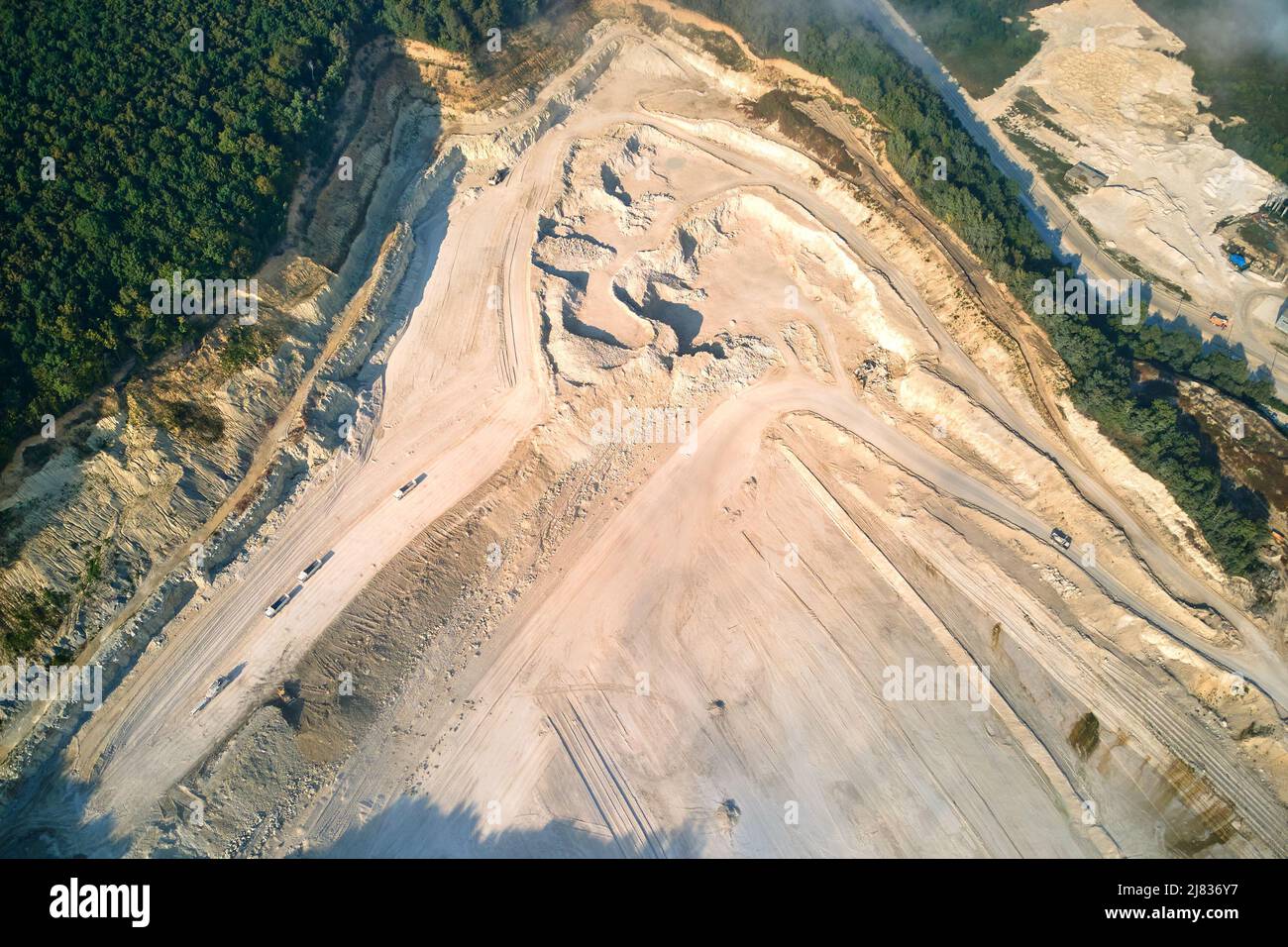 Aerial view of open pit mining of limestone materials for construction ...