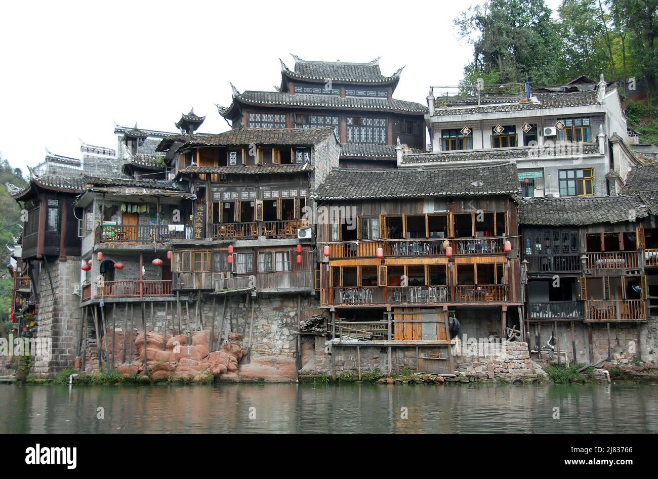 Fenghuang, Hunan Province, China: Old wooden riverside houses in ...
