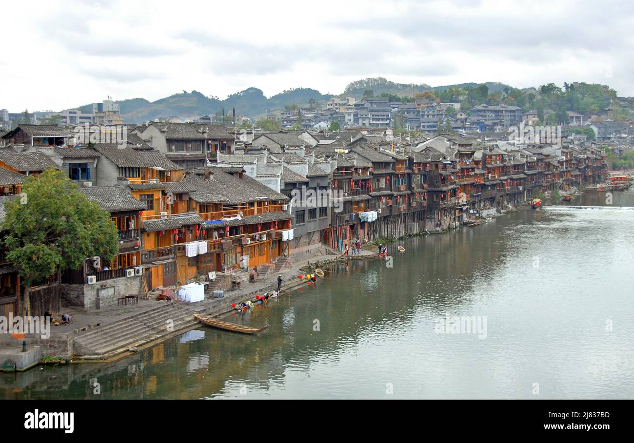 Fenghuang, Hunan Province, China: Old wooden riverside houses in ...