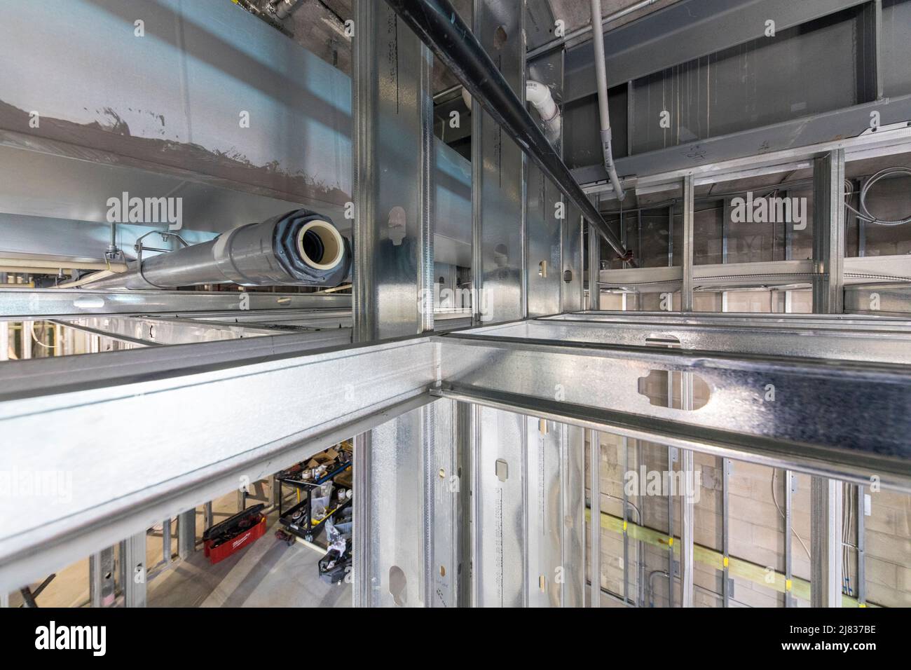 View of the structural space above the drop down ceiling in a ...