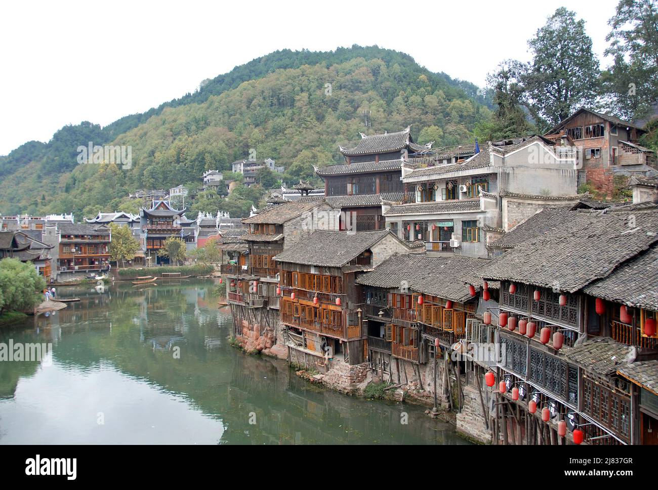 Fenghuang, Hunan Province, China: Old wooden riverside houses in ...