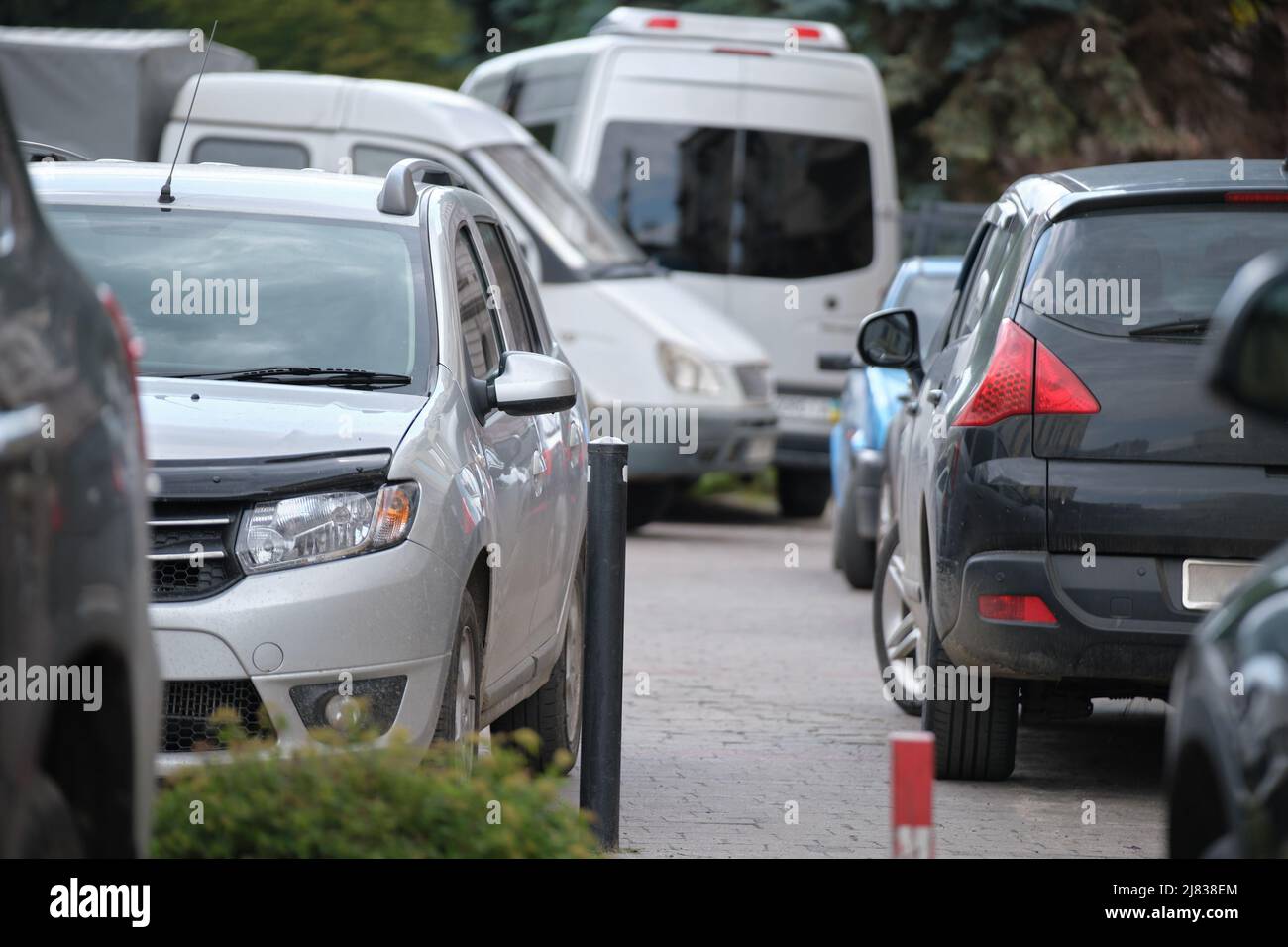 Cars parked in line on city street side. Urban traffic concept Stock ...