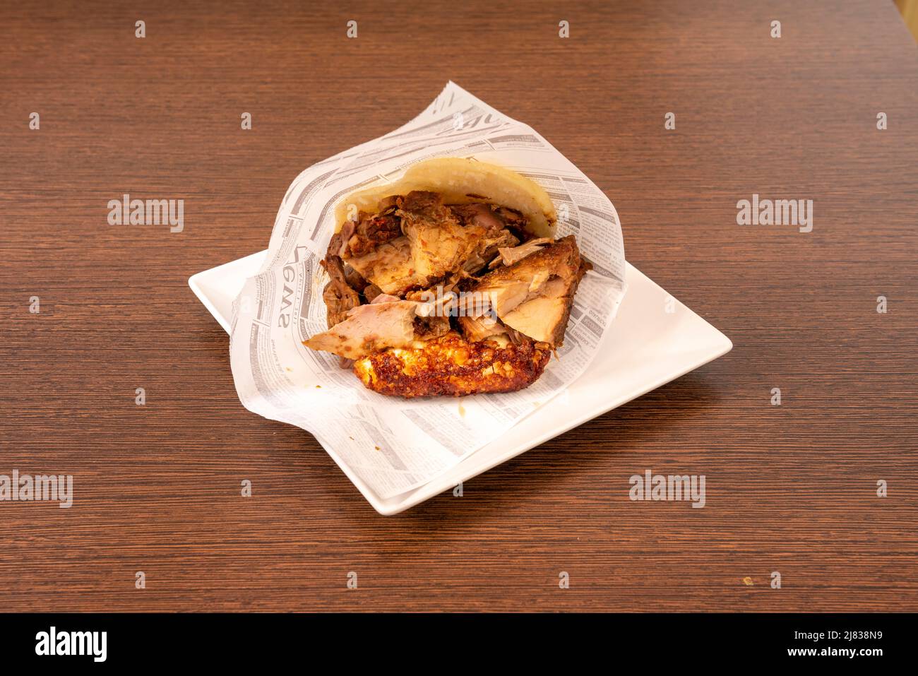 arepas rumberas or stuffed with roasted pork leg. Delicious Venezuelan ...