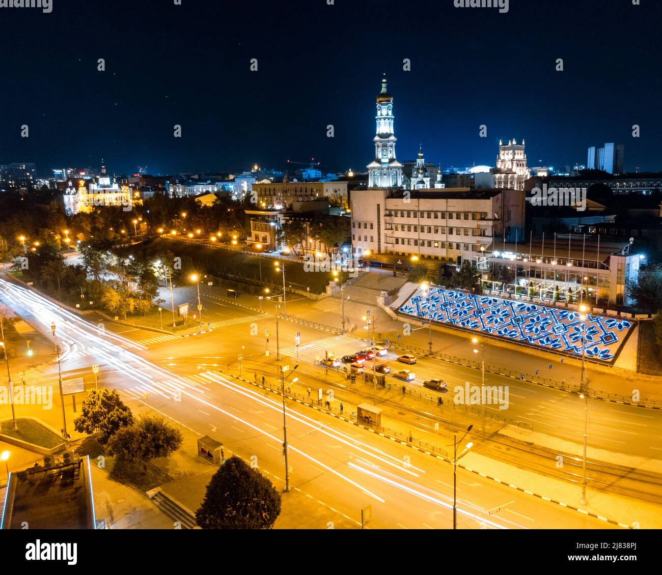 Night city center streets with cars driving in long exposure. Aerial ...