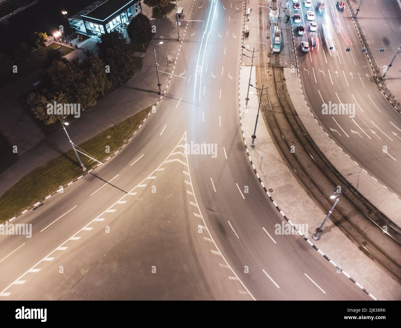 Night city center crossroad transport traffic. Aerial look down view on ...