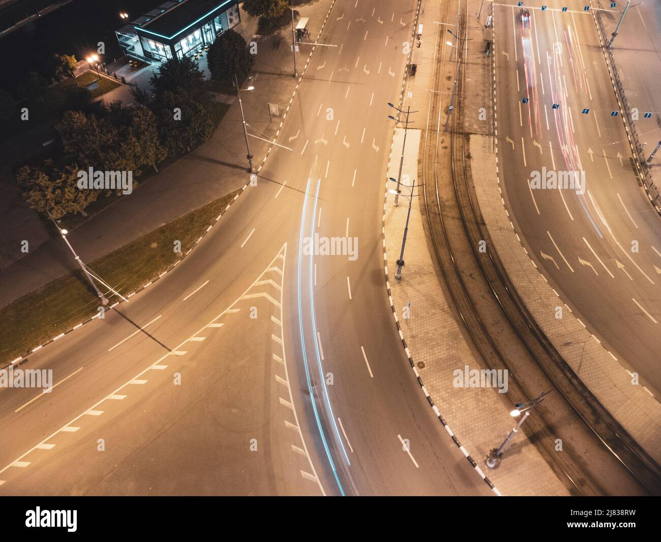 Night city center crossroad transport lights lines in long exposure ...
