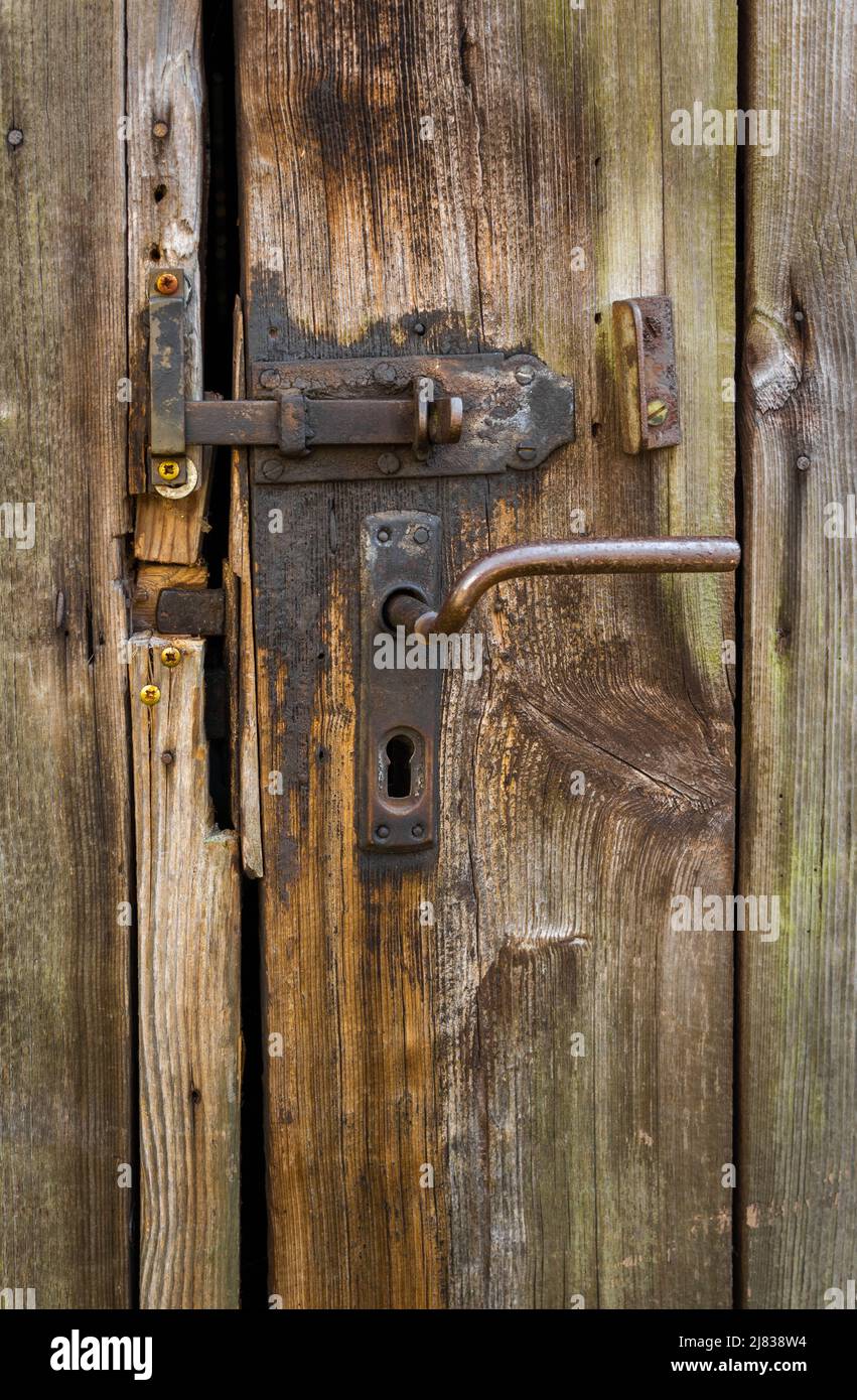 close-up of beautiful nostalgic locks on a barn door made of rustic ...