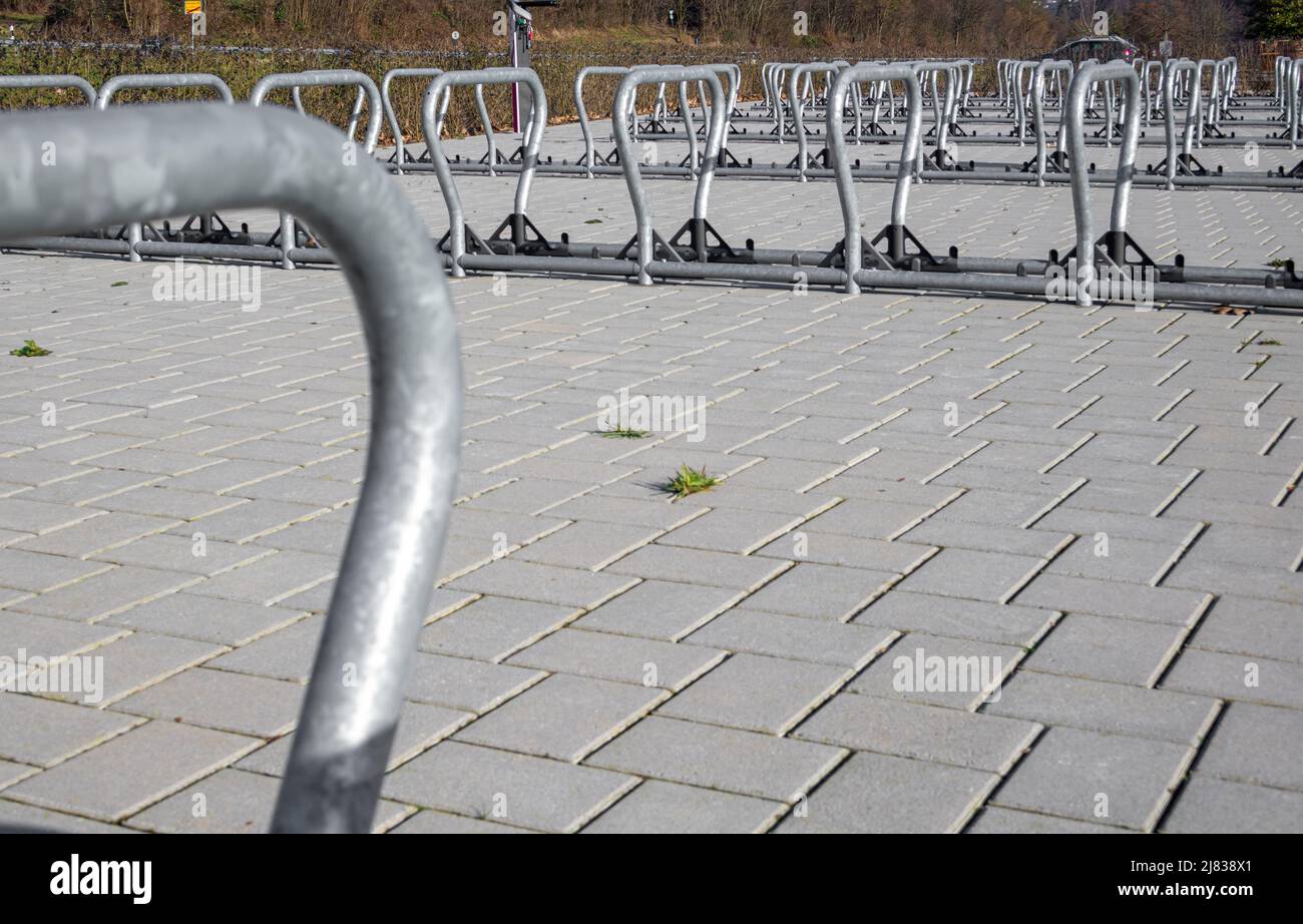 Close ups of a group of modern bike racks in bracket shape on a large ...