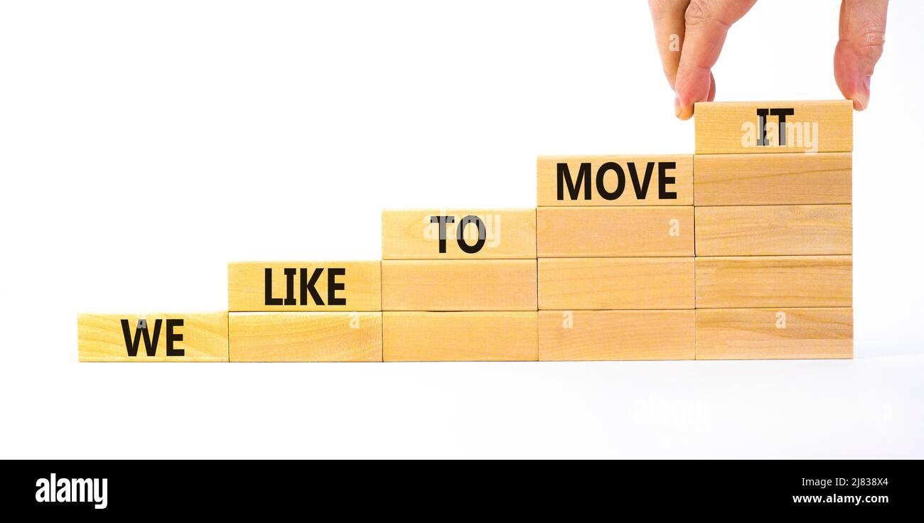 We like to move it symbol. Concept words We like to move it on wooden ...