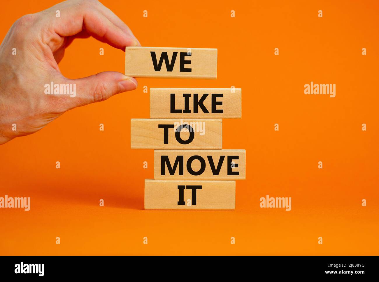 We like to move it symbol. Concept words We like to move it on wooden ...