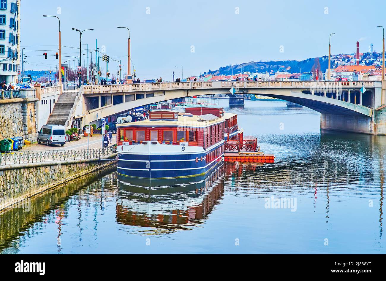 The classic ship is a boat hotel, moored at the bank of Vltava River ...