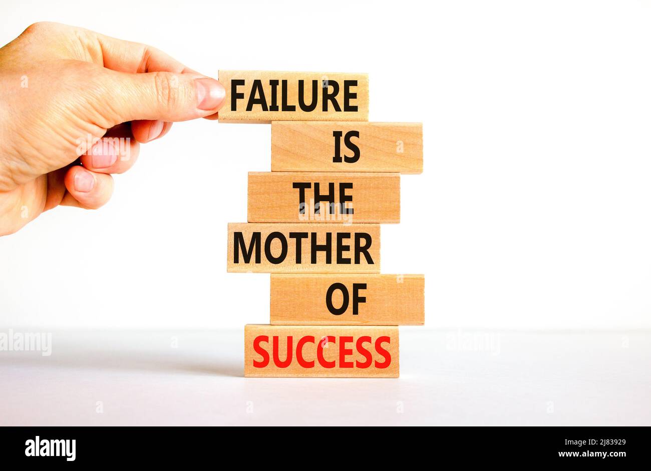 Failure or success symbol. Wooden blocks with words A failure is the ...