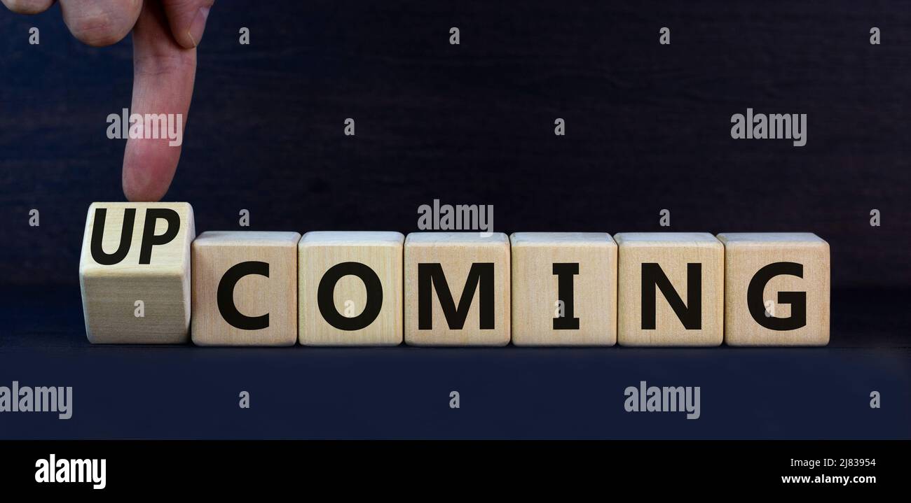 Coming or upcoming symbol. Turned wooden cubes and changed the word ...