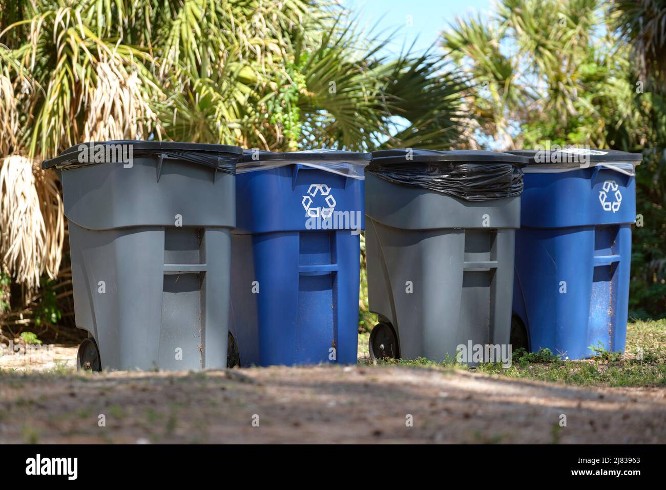 Garbage cans for separate disposal of recycle trash on city street ...