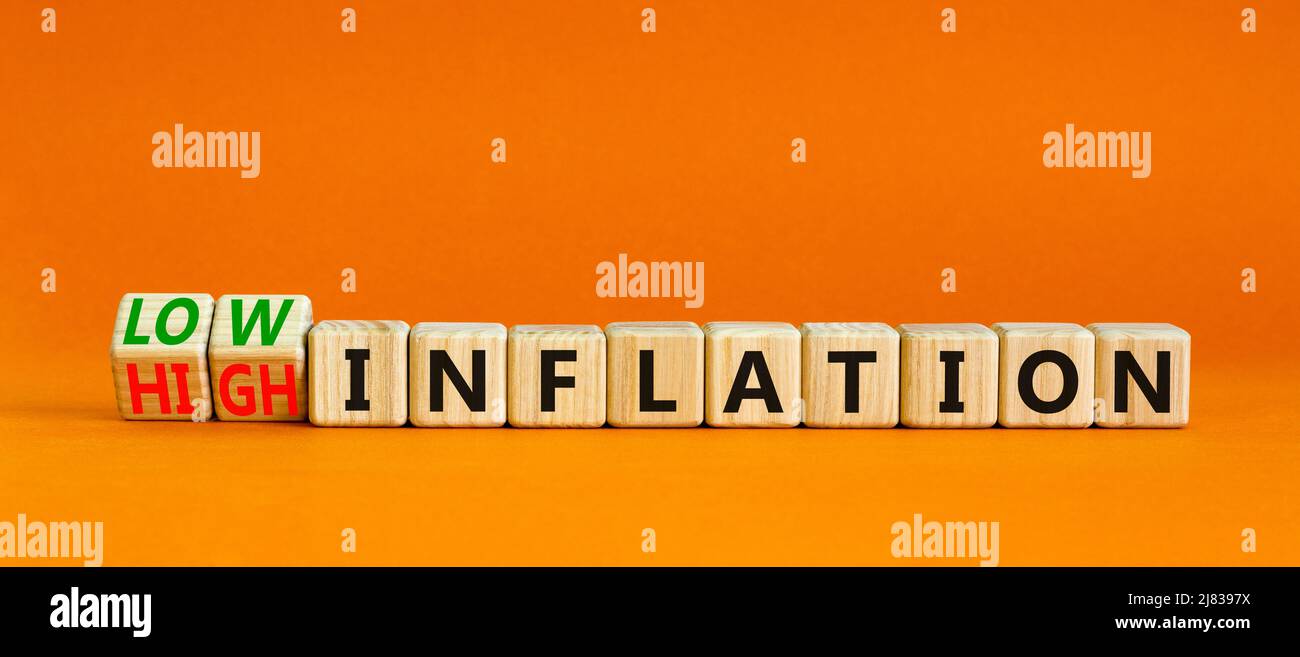 High or low inflation symbol. Turned wooden cubes and changed concept ...