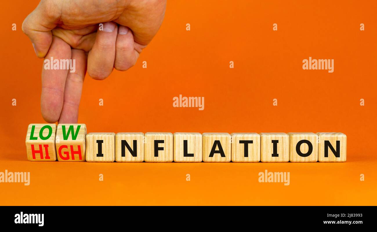High or low inflation symbol. Businessman turns cubes and changes ...