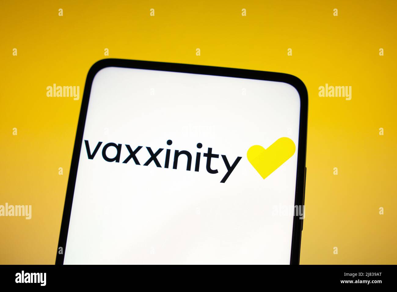 In this photo illustration, the Vaxxinity logo seen displayed on a ...