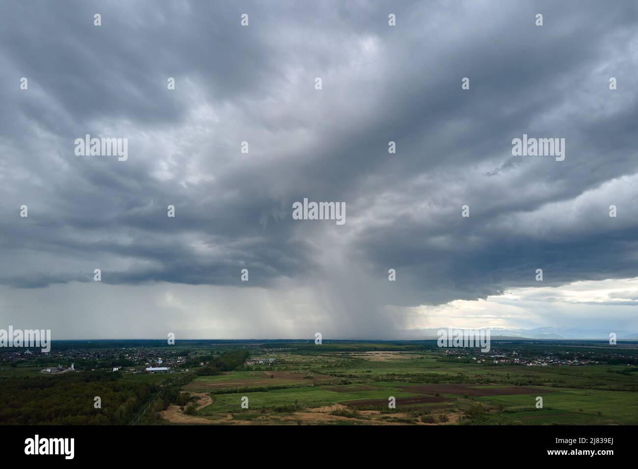Landscape of dark clouds forming on stormy sky during thunderstorm over ...