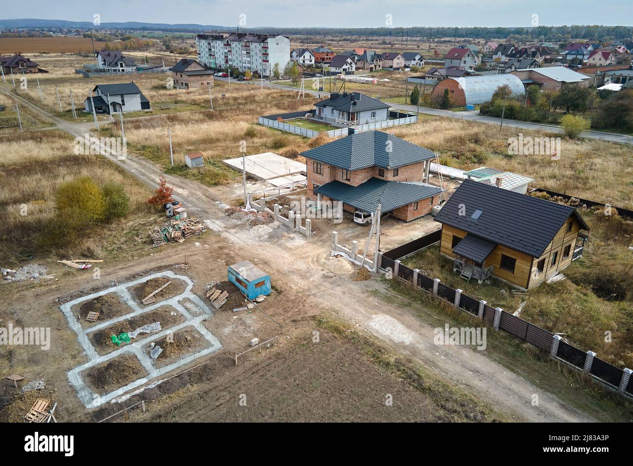 Top down aerial view of building works of new house concrete foundation ...