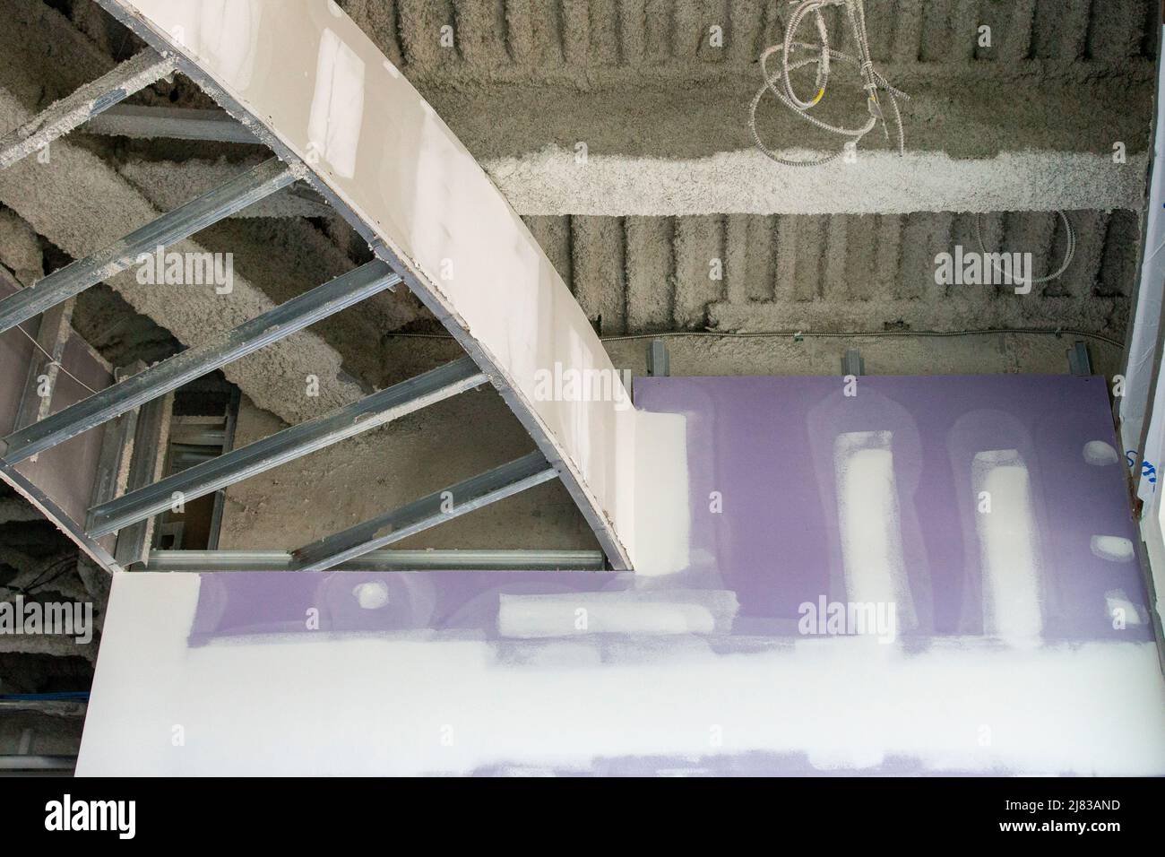 Installed sheetrock / drywall overhead with a horizontal Stock Photo ...